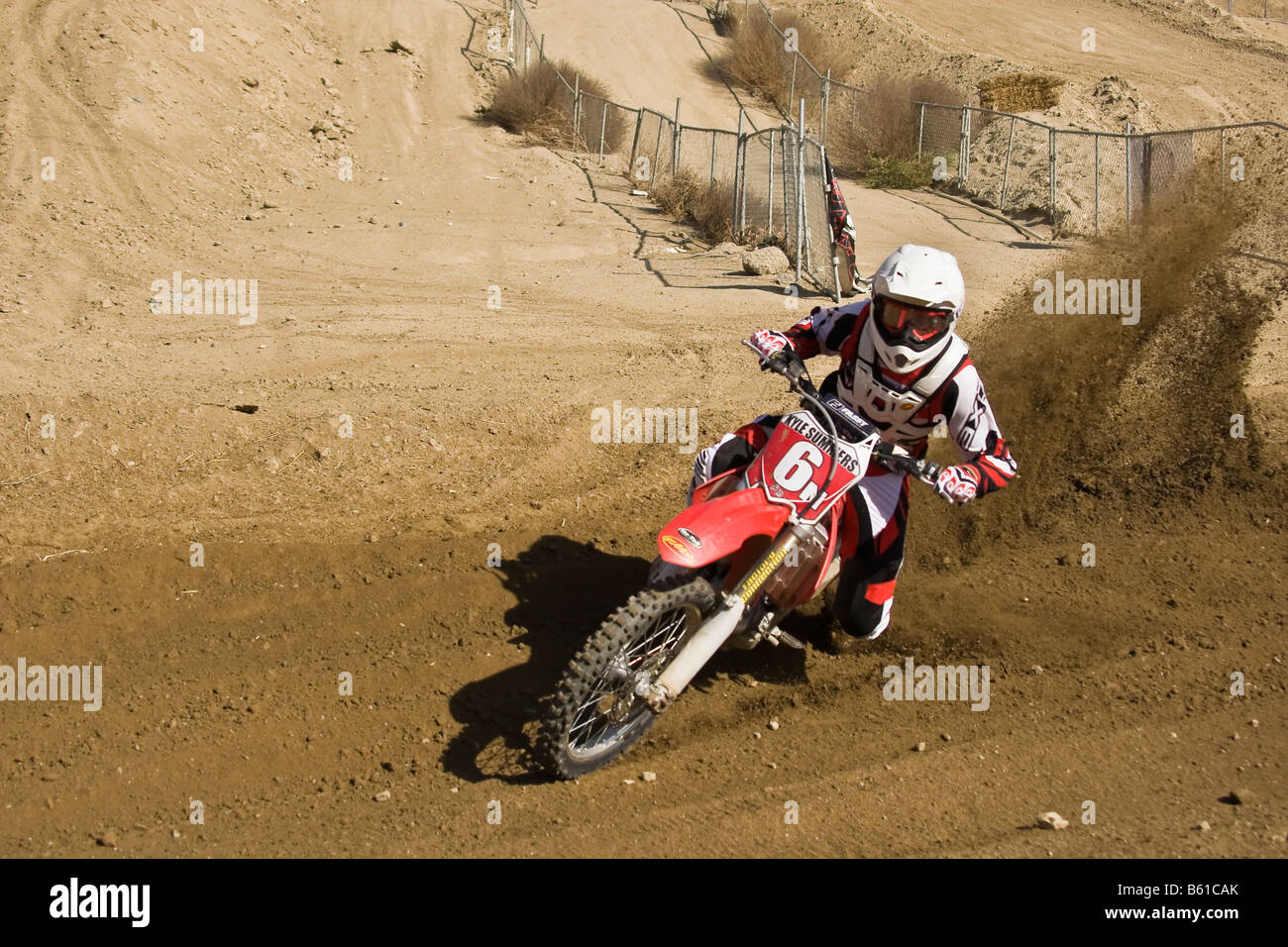 Motorcross rider sweeping through a bend at Glen Helen circuit Devore ...