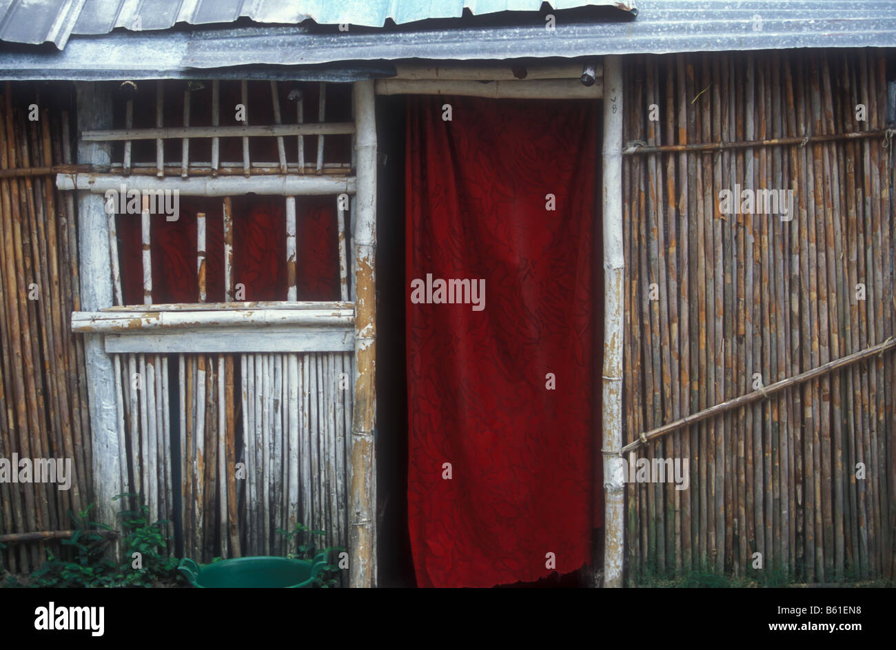 Traditional house with a deep red curtain for a door Stock Photo - Alamy