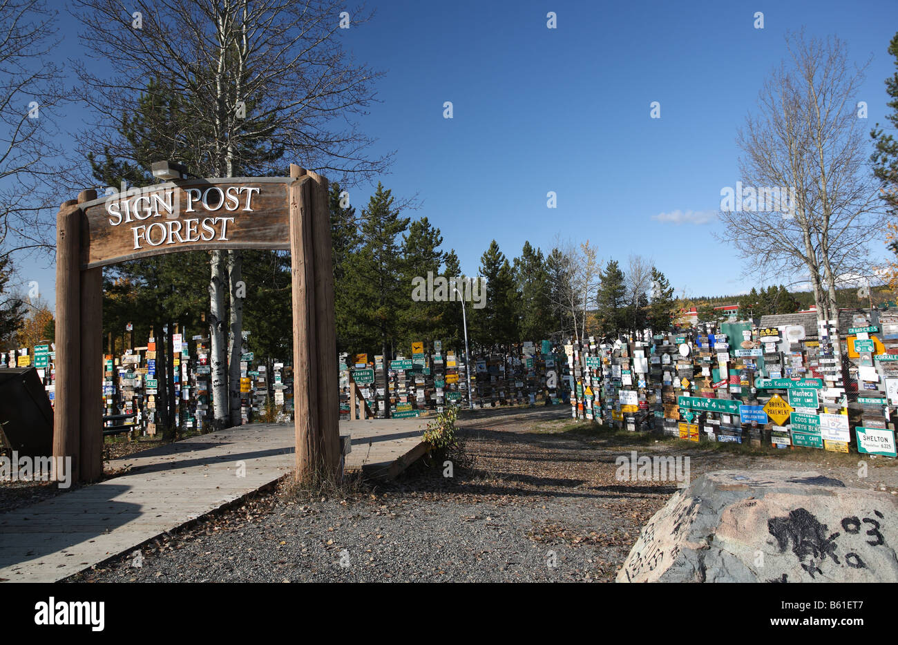 Sign posts forest in Watson Lake Yuko Stock Photo - Alamy