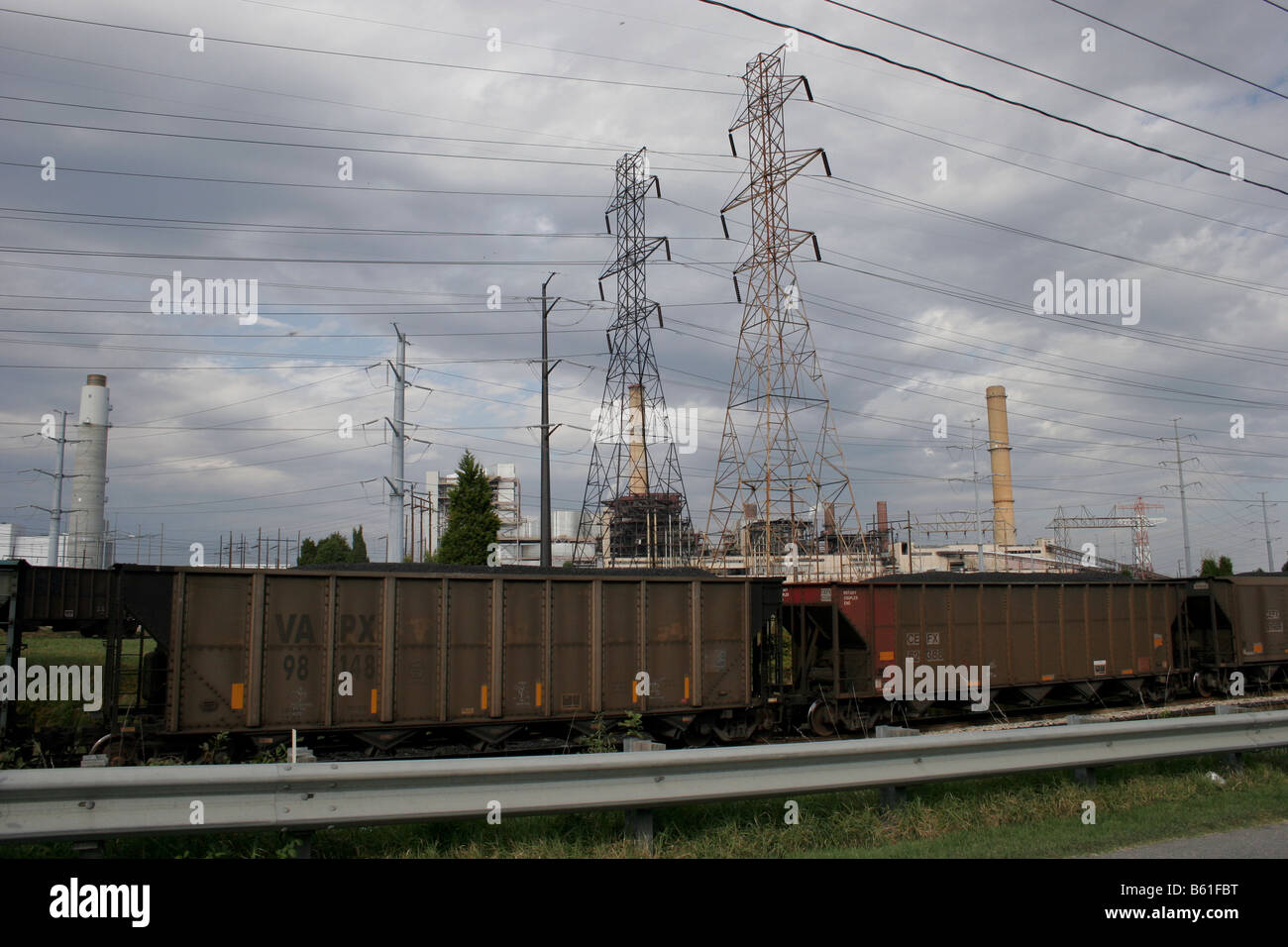 Freight train delivering coal to power plant to generate electricity ...