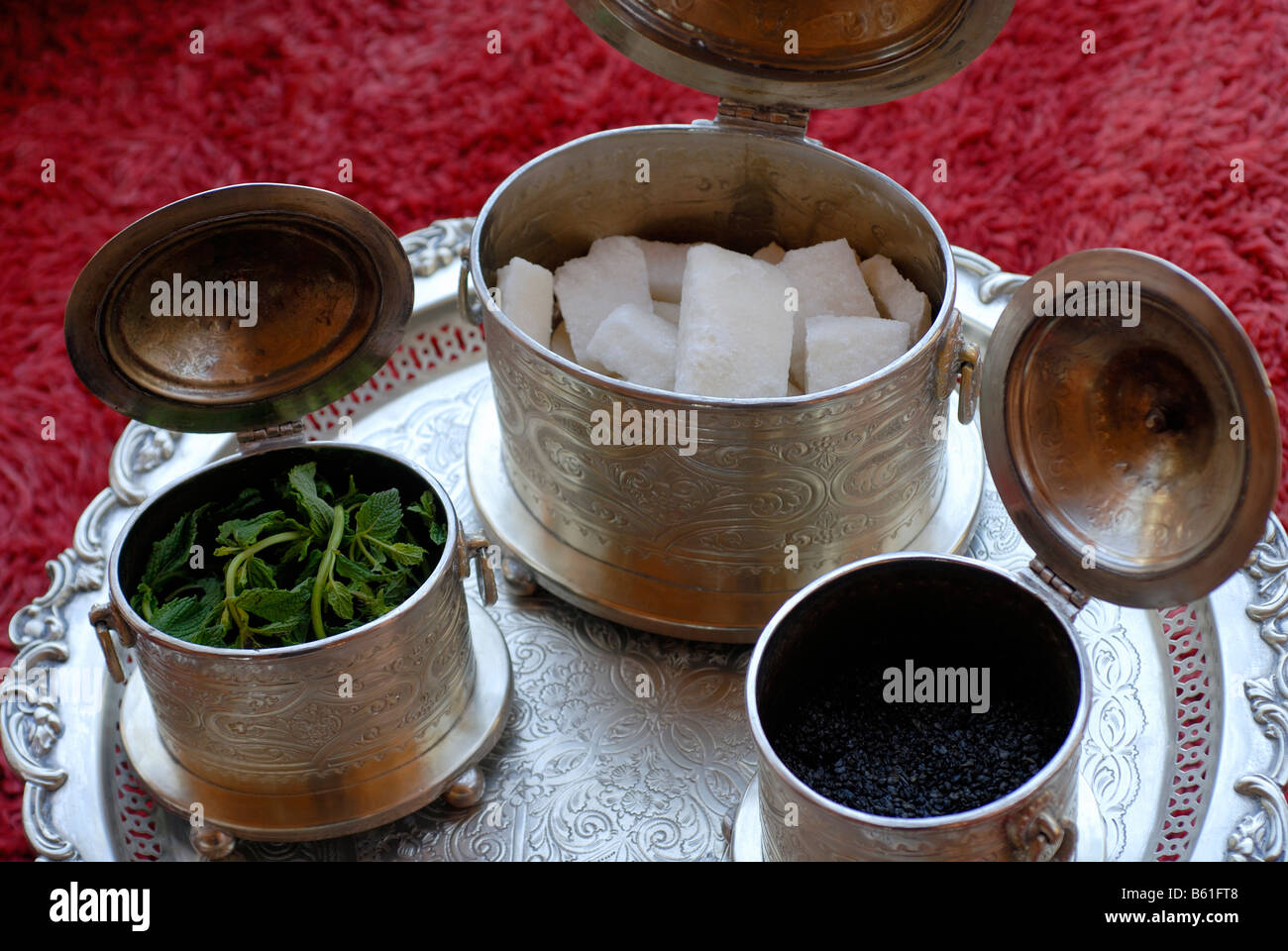 Moroccan mint tea sugar cubes tea leaves and fresh mint served on a ...