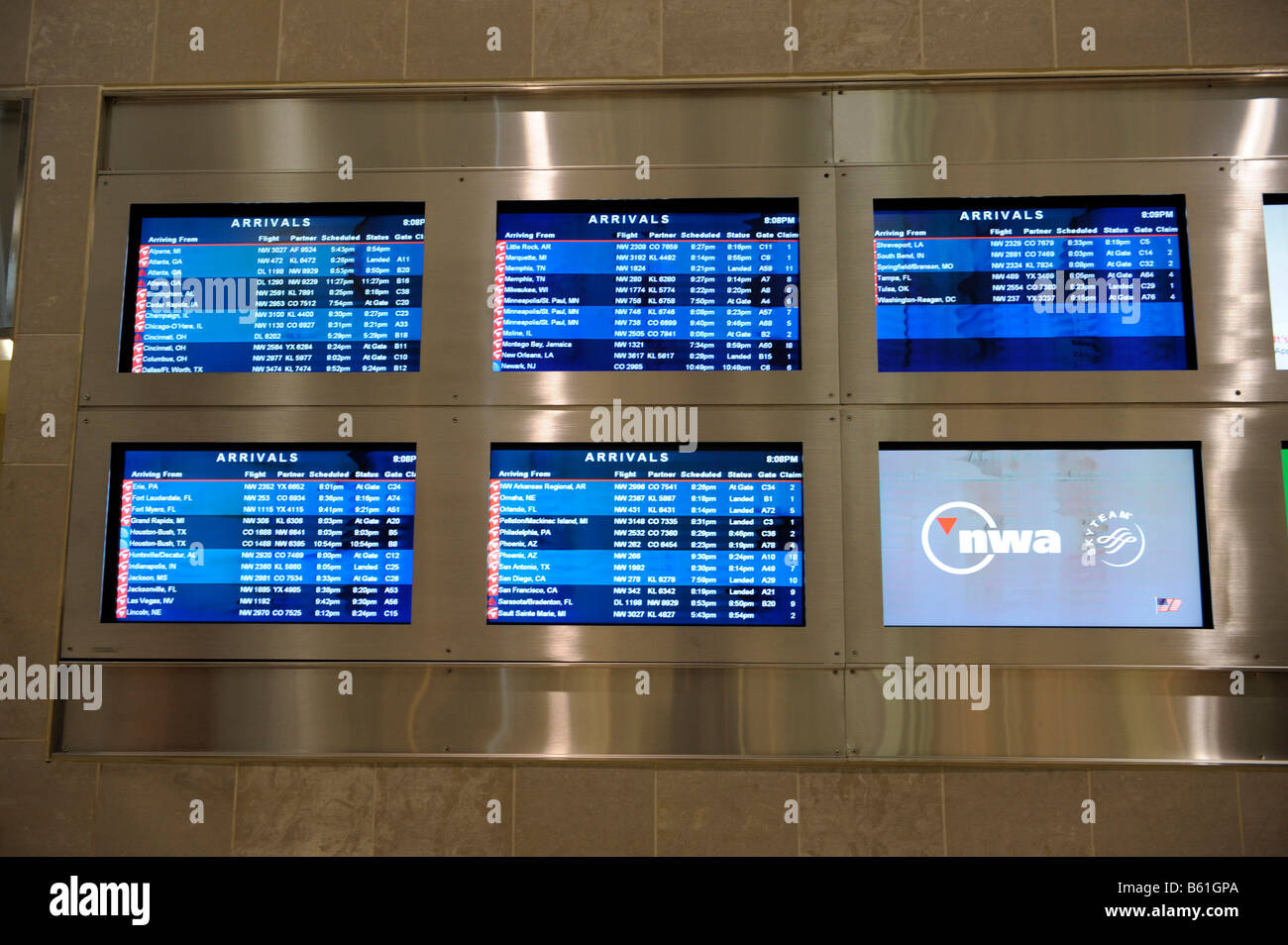 Arrival times diplayed at airport Stock Photo - Alamy