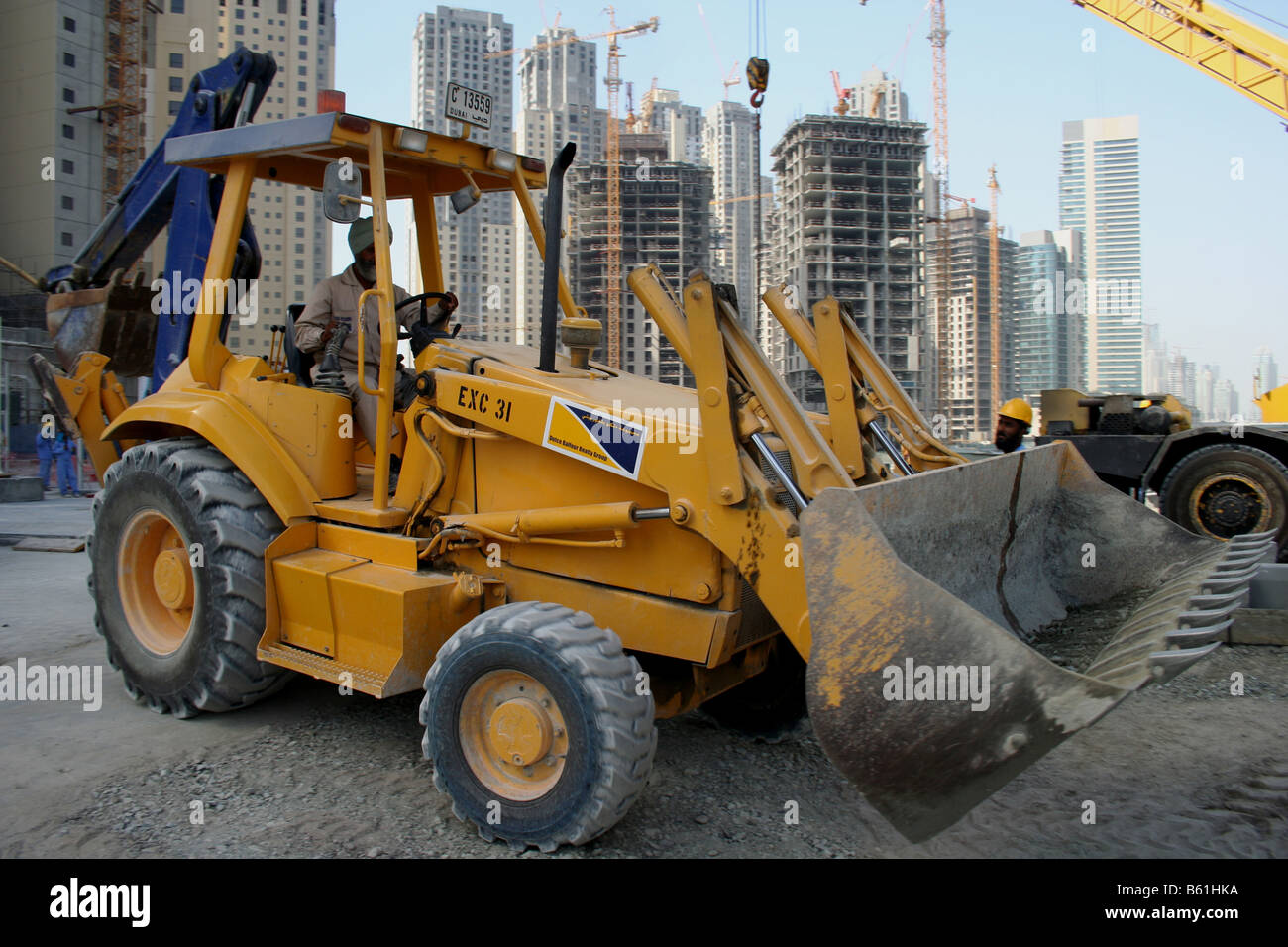 bulldozer tractors dubai building site machinery Stock Photo - Alamy