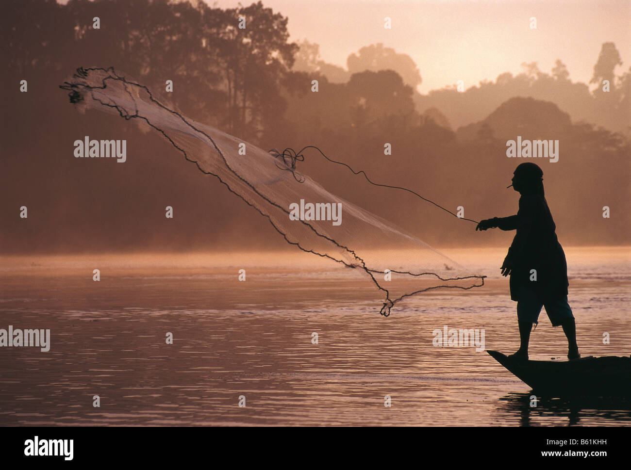 River fisherman casting net Stock Photo - Alamy
