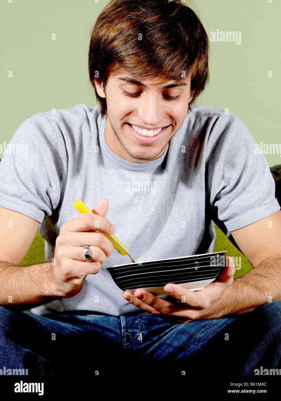 Young Man Eating Beans Model Released Stock Photo - Alamy