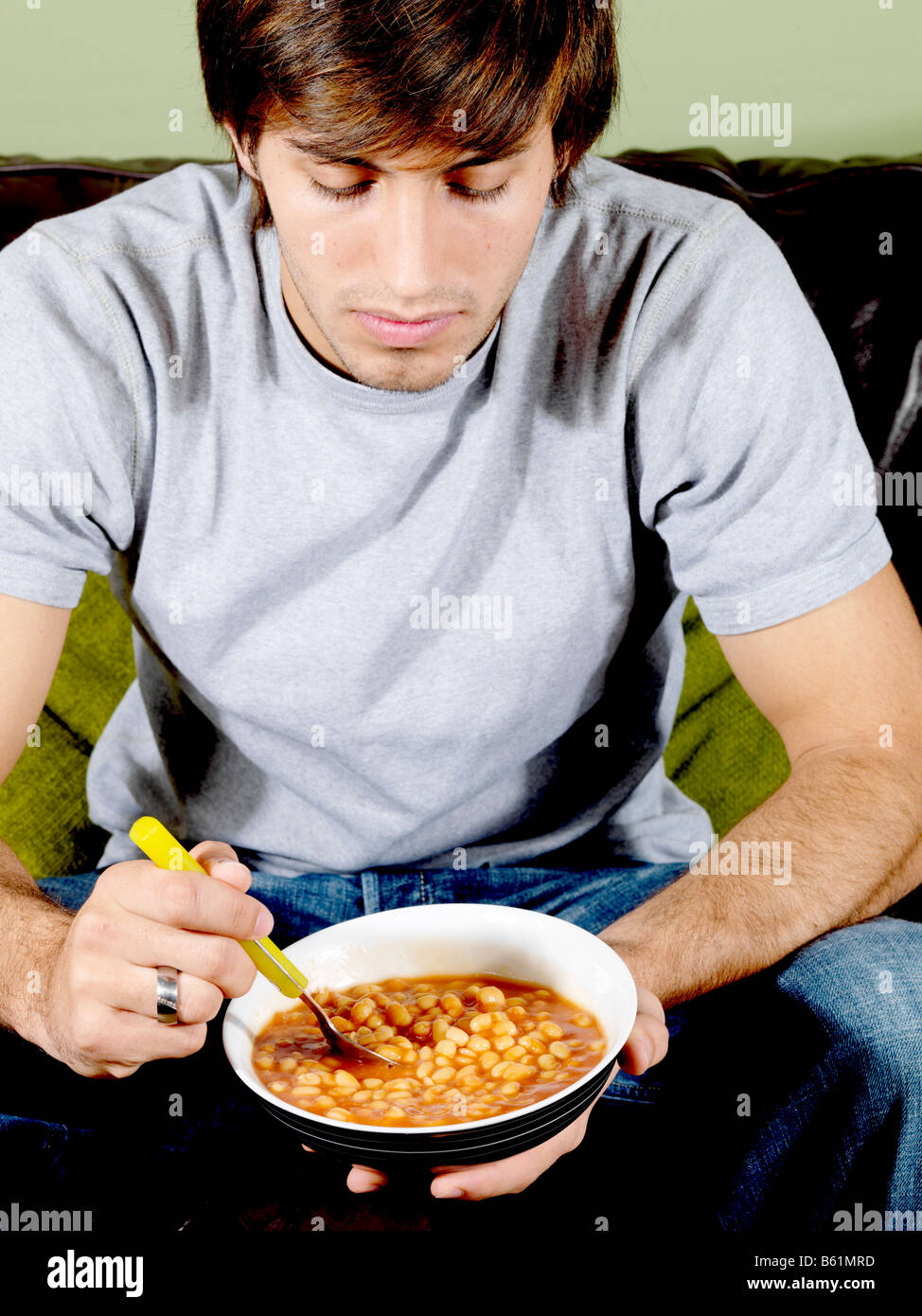 Young Man Eating Beans Model Released Stock Photo - Alamy
