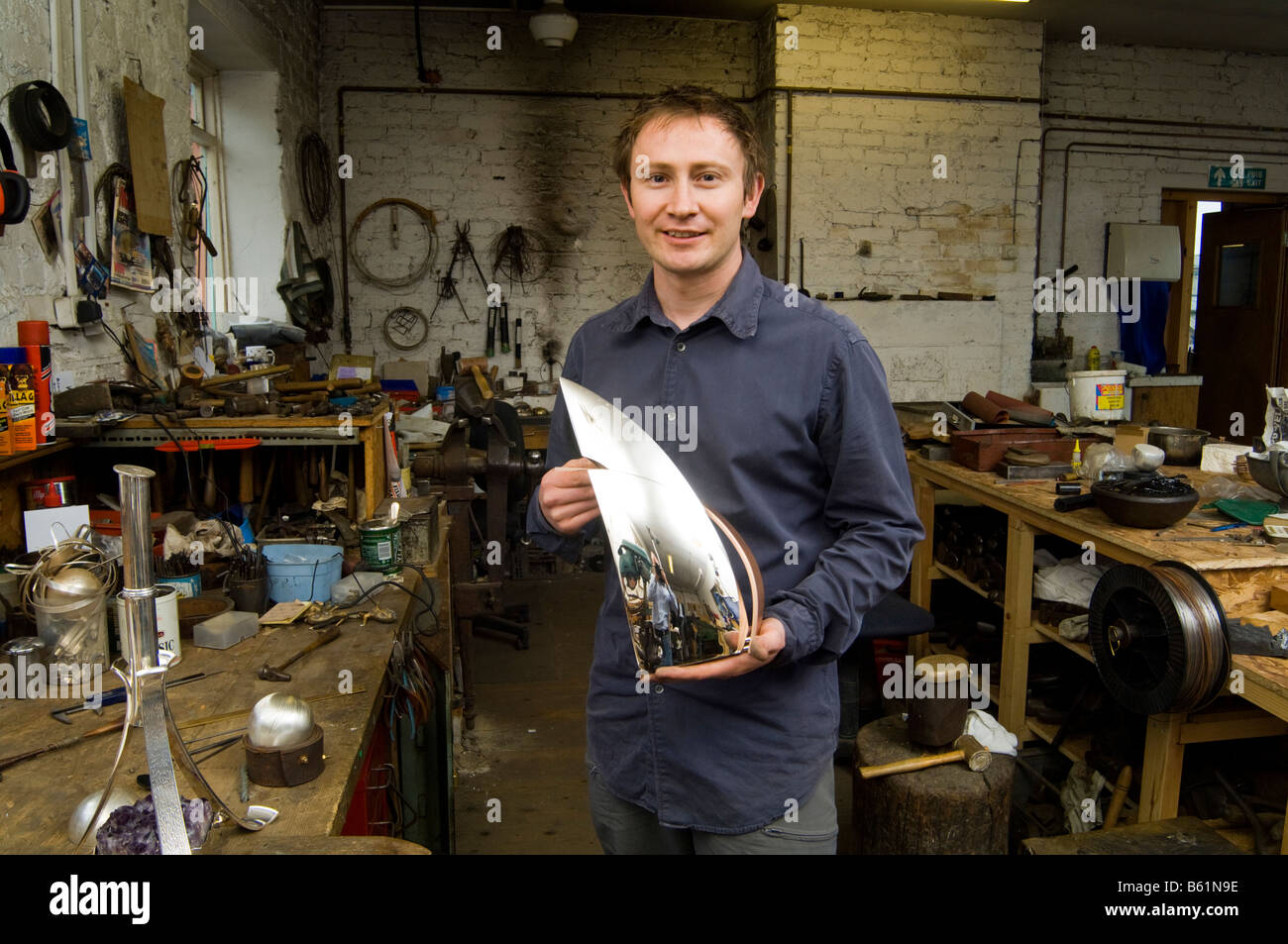 Silversmith Christopher Perry at his workshop in Sheffield Stock Photo ...