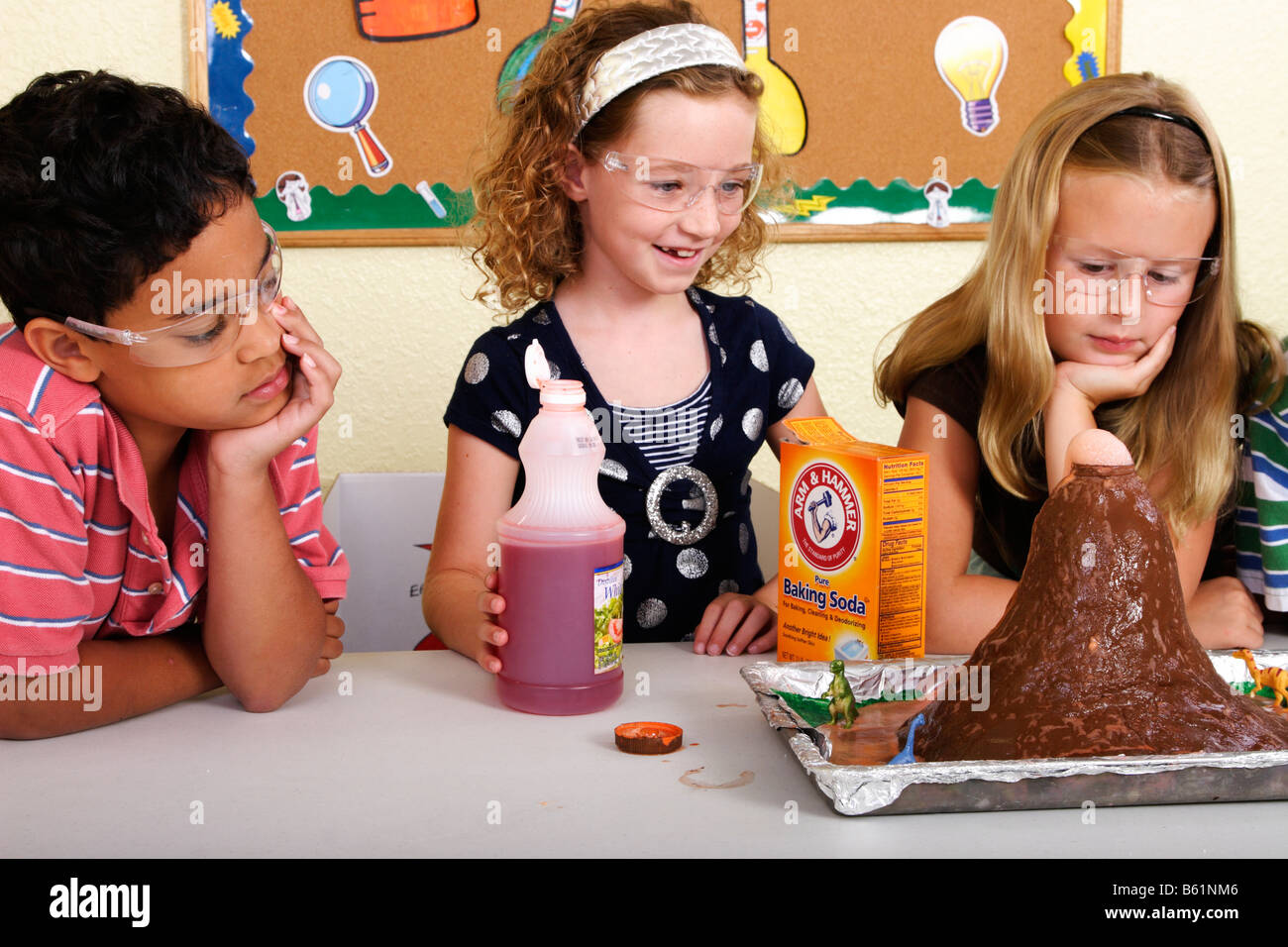 School kids working on a volcano science project Stock Photo - Alamy