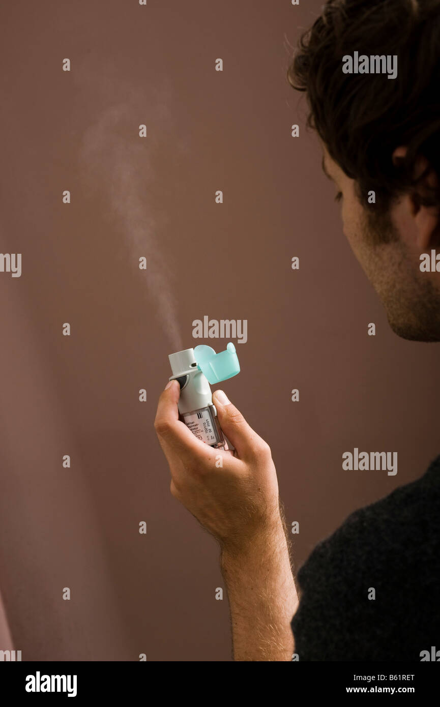 Man holding an inhalation spray Stock Photo - Alamy