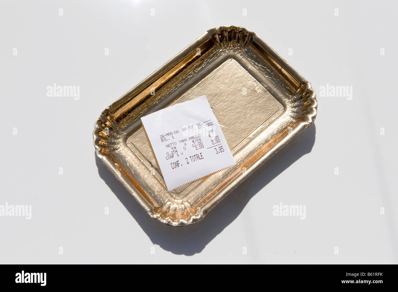 Golden paper plate with bill Stock Photo - Alamy