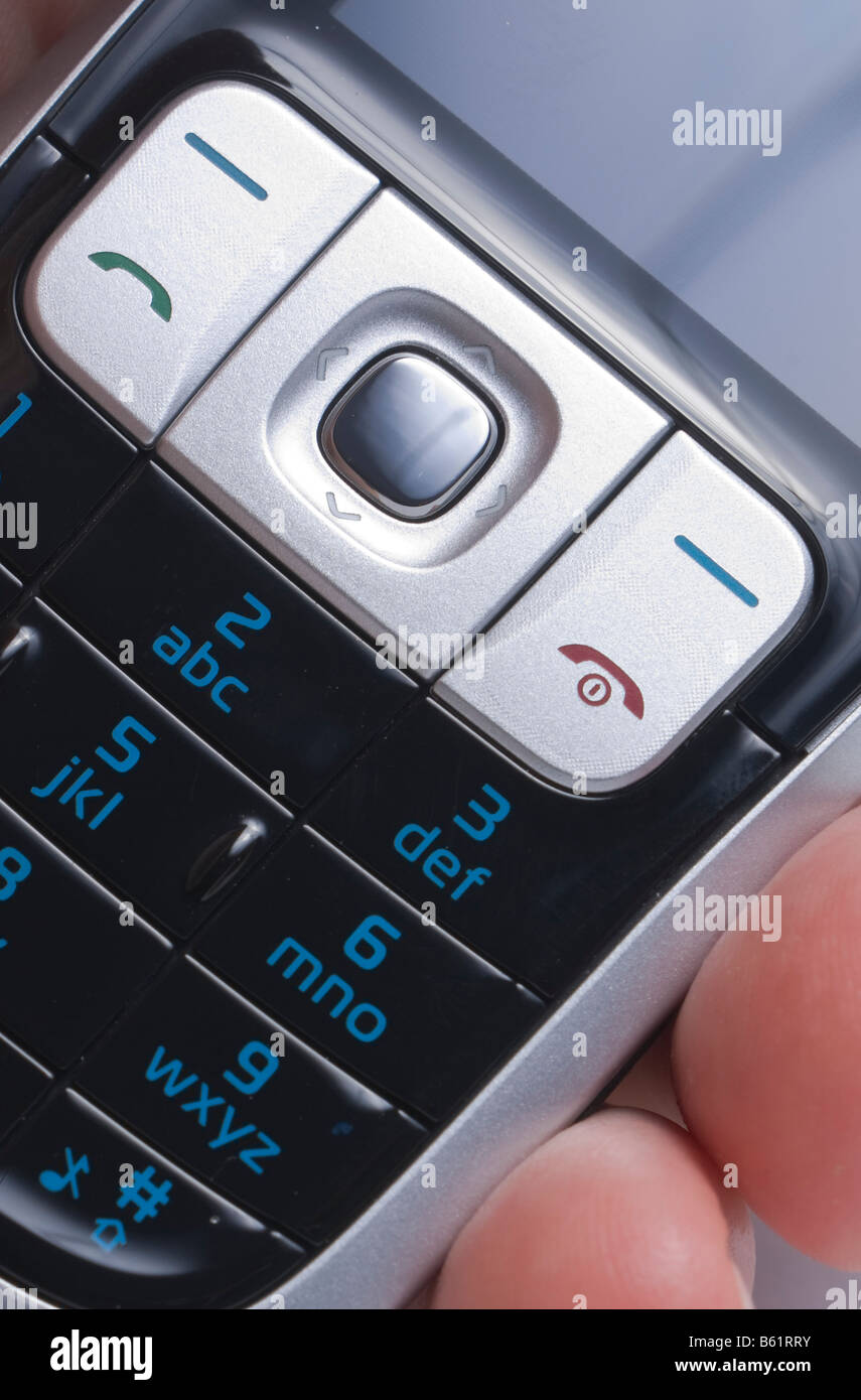 Cellphone held in hand. Close up of keypad and fingers. Communication ...