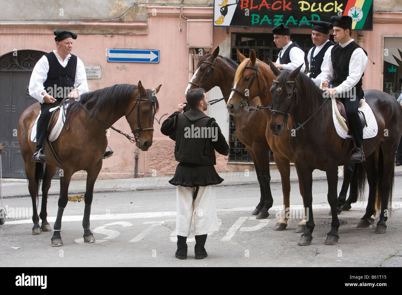 Horseback riders wearing traditional costumes at the Cavalcata Sarda ...