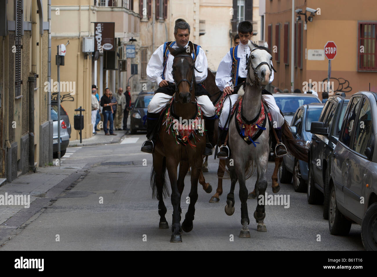 Horseback riders wearing traditional costumes at the Cavalcata Sarda ...