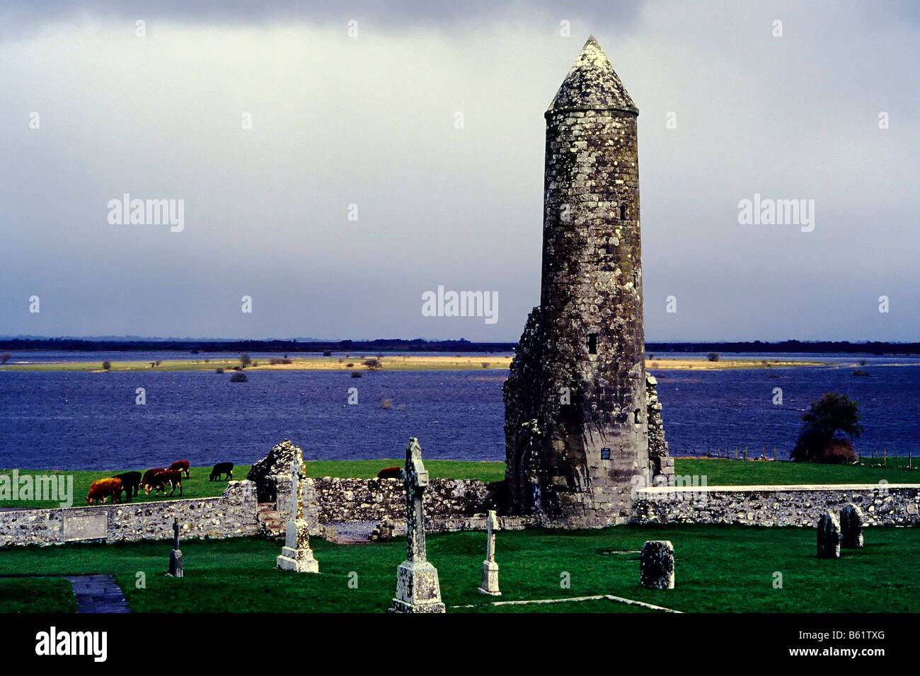 Round tower and graveyard, ruin of the Clonmacnoise Abbey on the banks ...