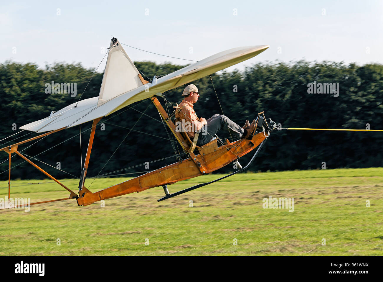 Historic glider SG38 being pulled on a cable into the air, wooden ...