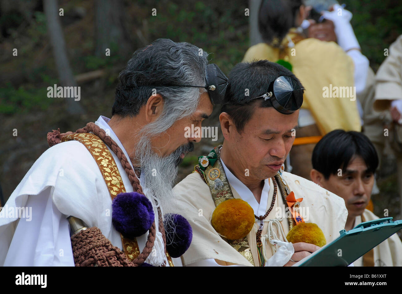 Yamabushi of differing ranks wearing traditional headdress and clothing ...