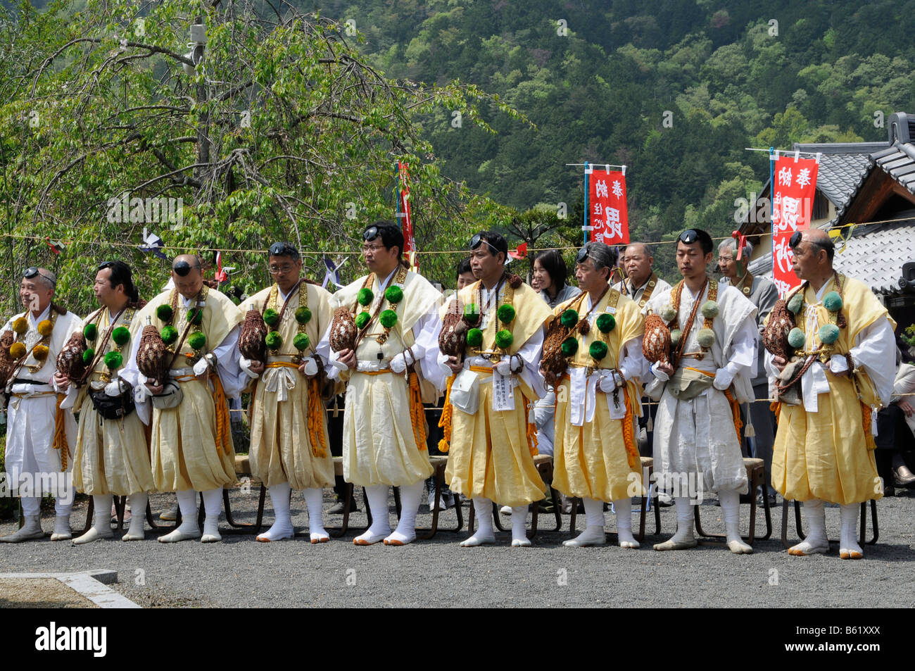 Assembly of the Yamabushi conch shell blowers at the fireplace in front ...
