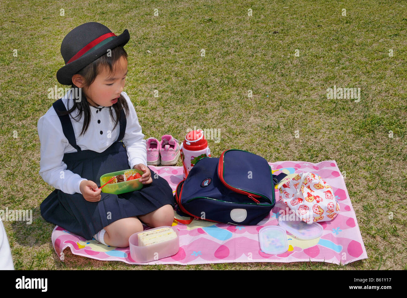 School girl wearing school uniform of an elite primary school during ...
