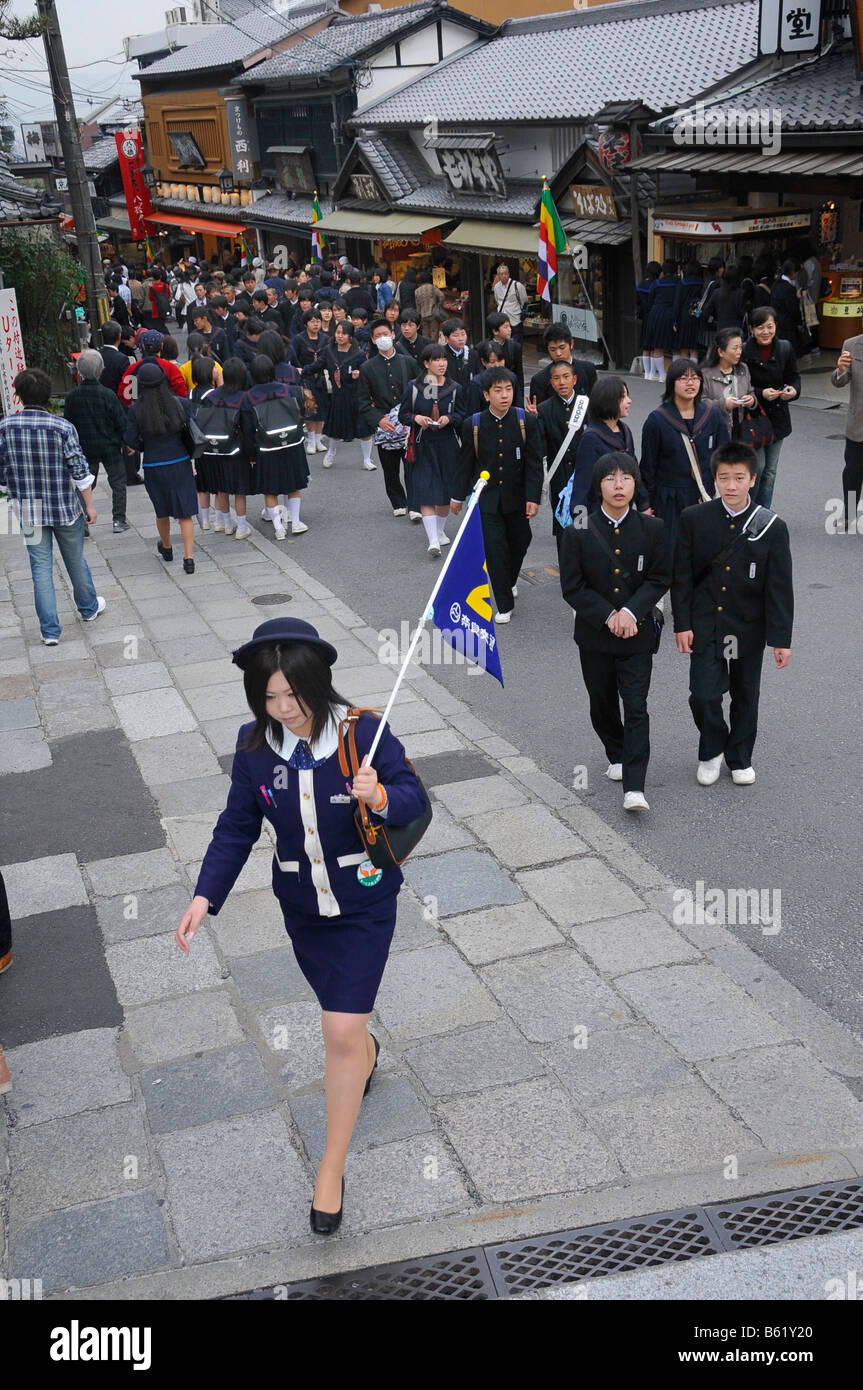 School children wearing Prussian school uniforms being lead through the ...