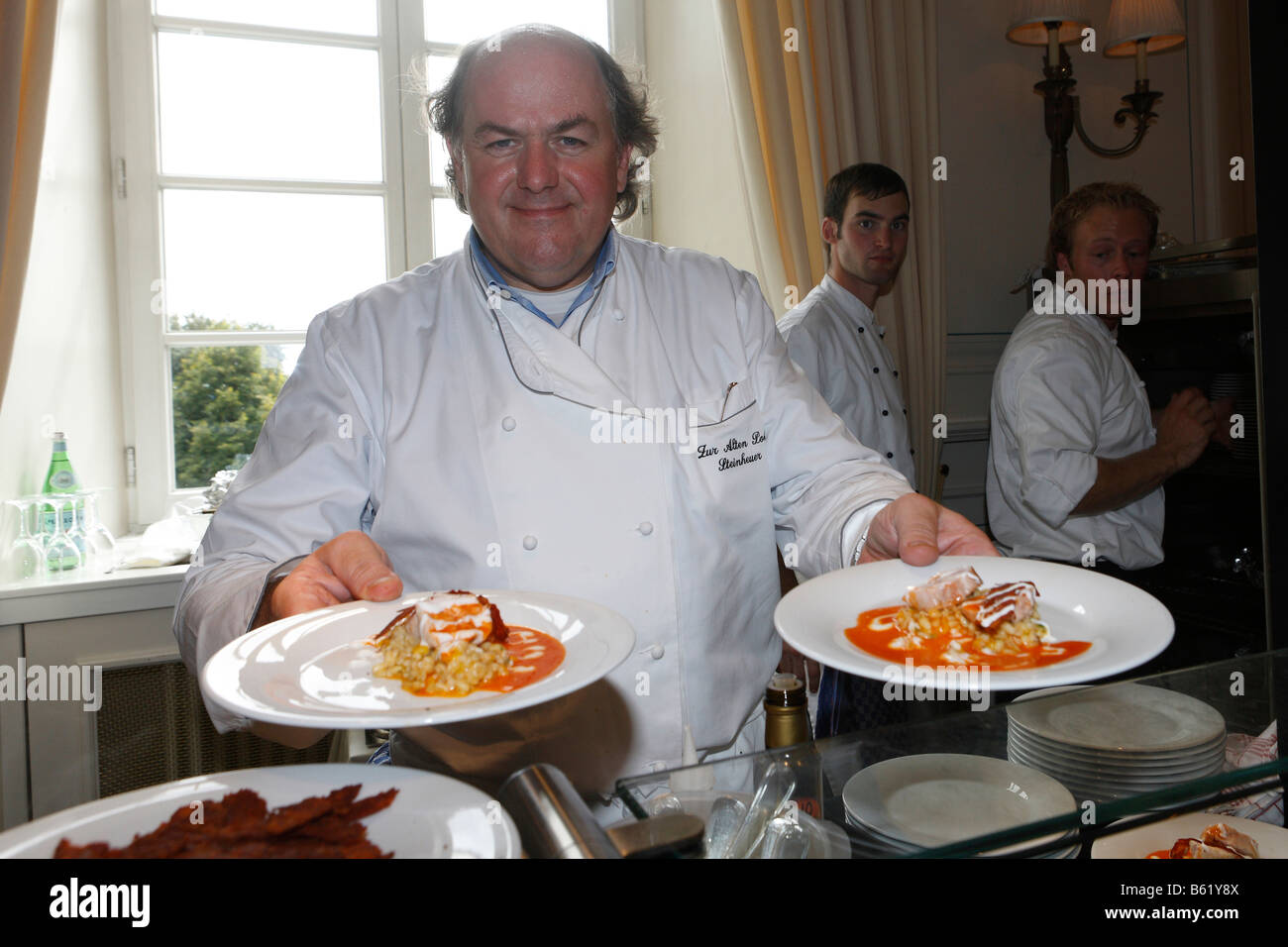 Cook presenting meals, Althoffs Festival of the Master Cooks ...