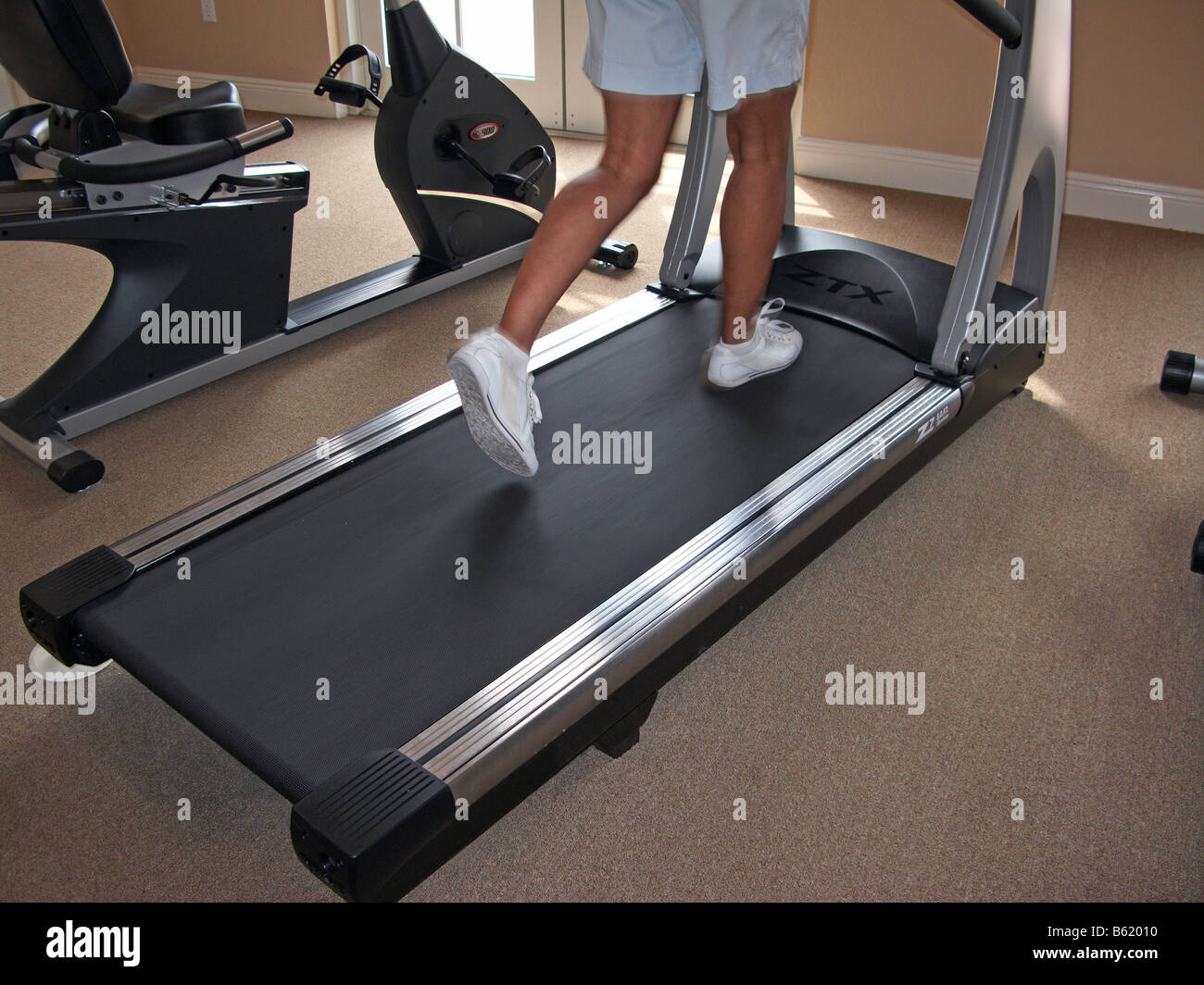 Woman on running machine High Resolution Stock Photography and Images ...
