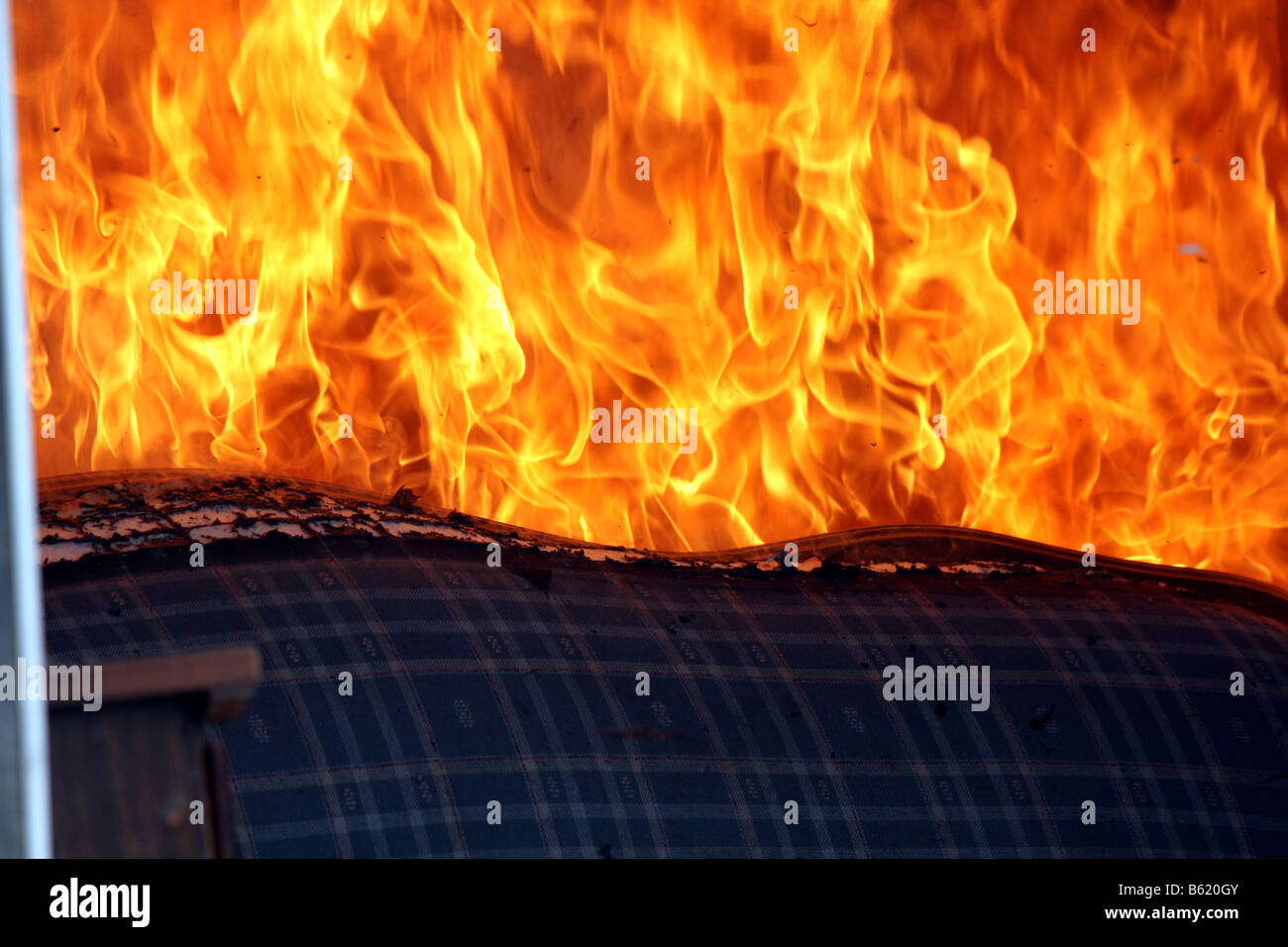 A couch on fire Stock Photo - Alamy
