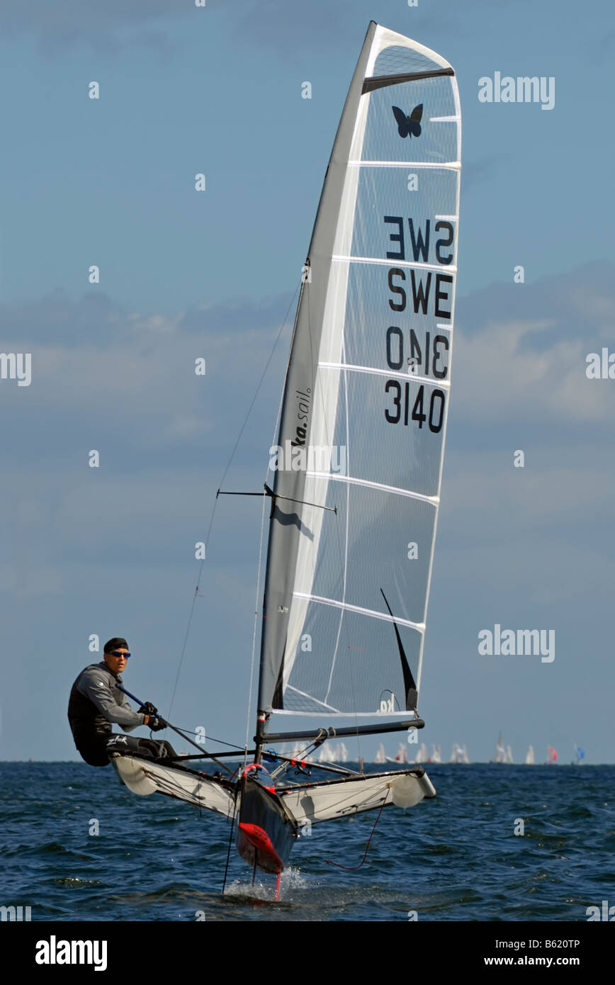 Sailor competing in the regatta for the sailing boat category ...