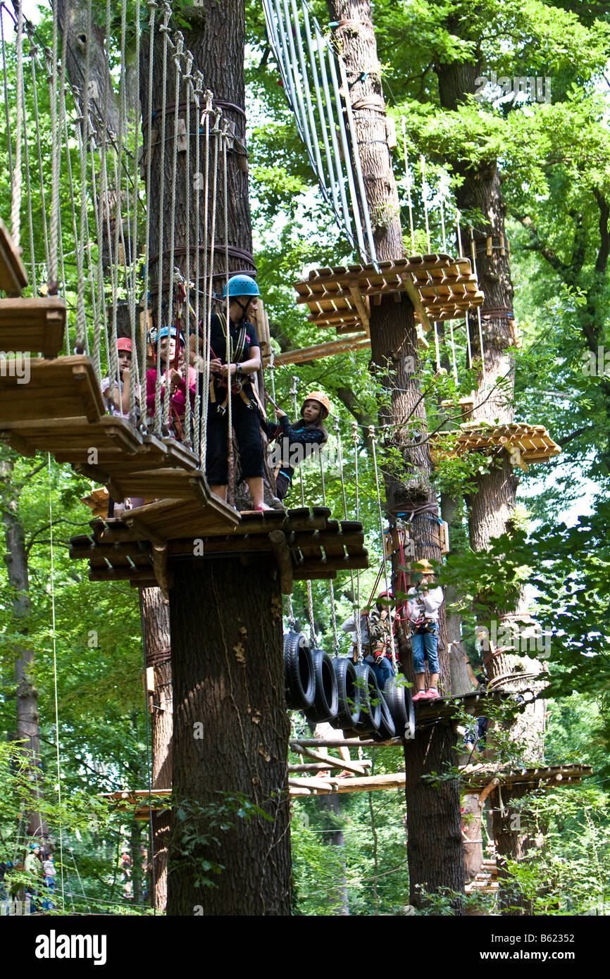 Ropes course made of car tyres and wooden beams strung between trees ...