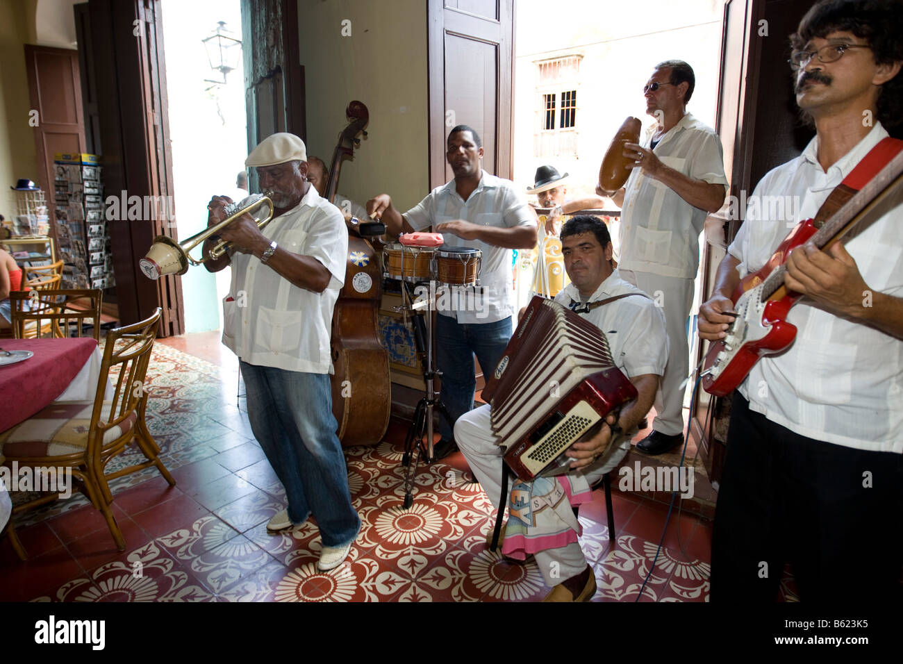 Cuban jazz musicians playing in a restaurant, Plaza Mayor, Trinidad ...