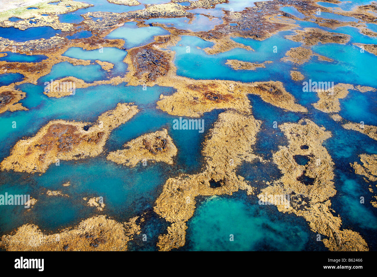 Multicolored labyrinth between rocks in the water from different ...