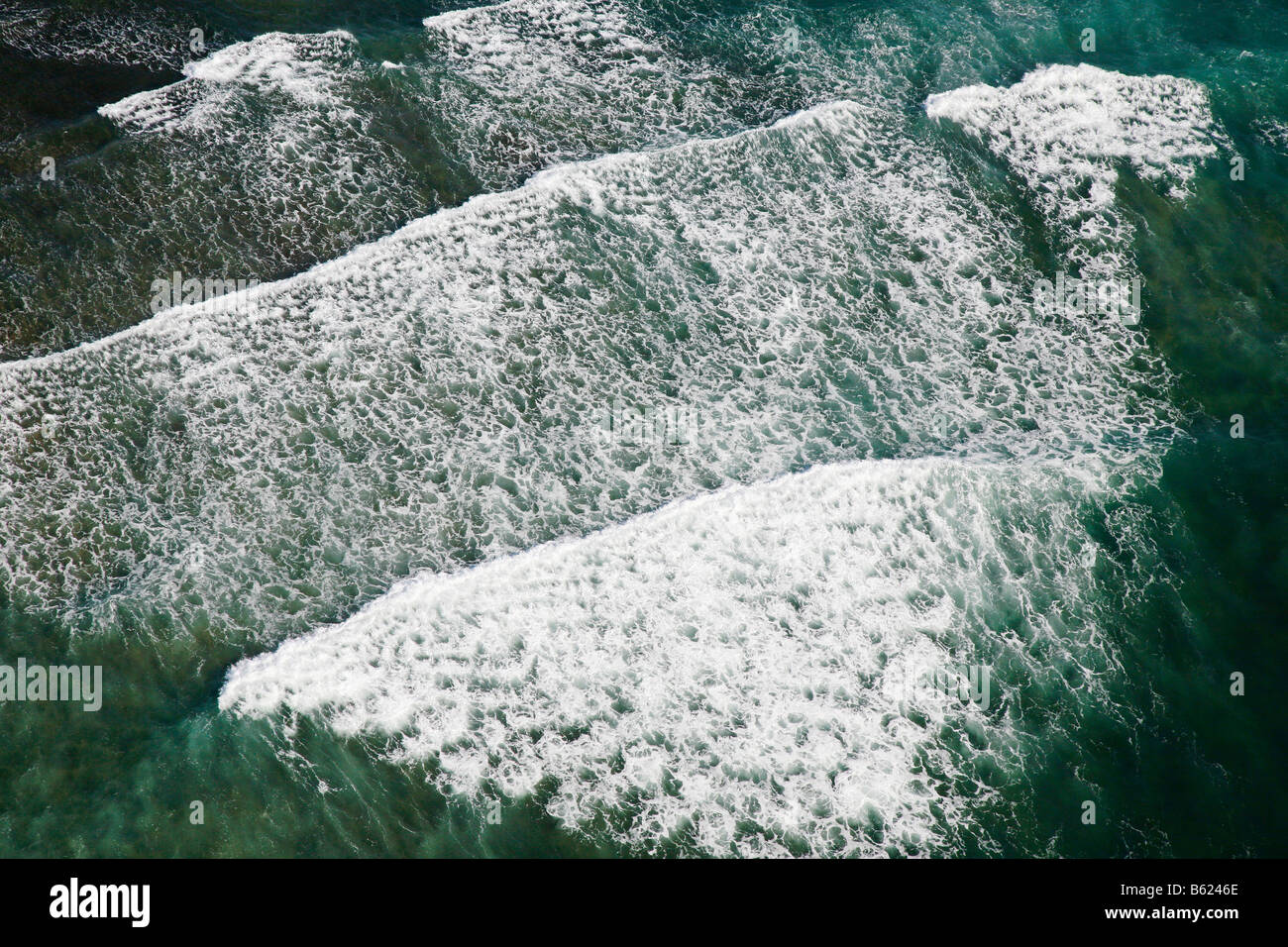 Aerial view of waves breaking on the south coast of Iceland, Europe ...