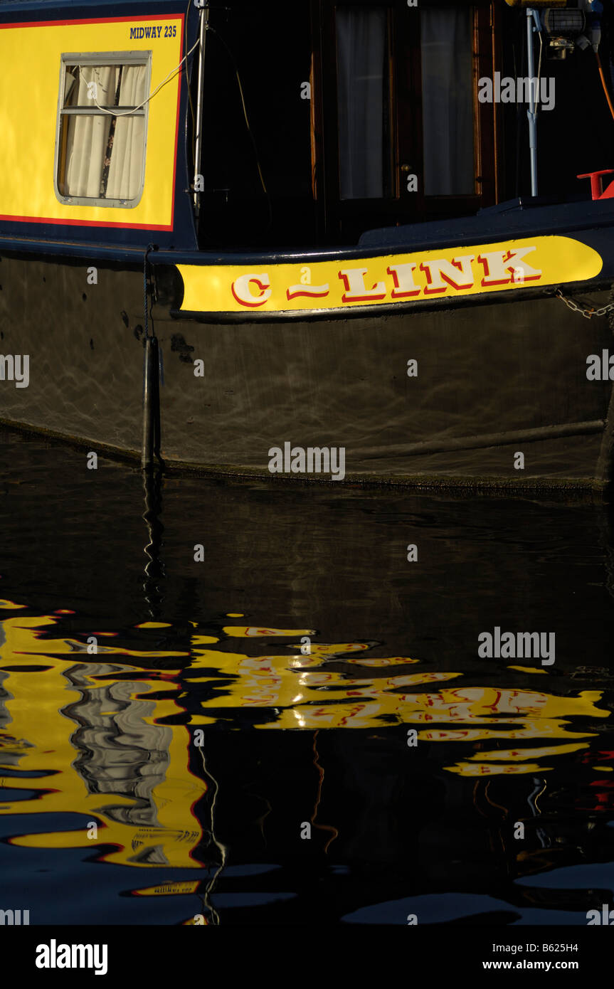 View of traditional English canal boat in morning sunshine with ...