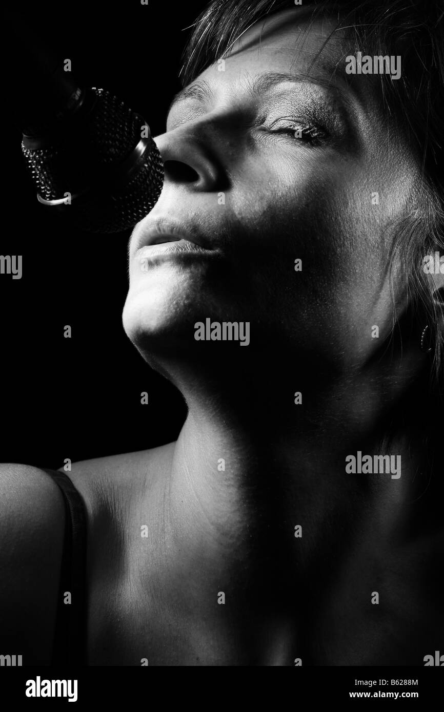 Singer, woman, microphone, studio Black and White Stock Photos & Images ...