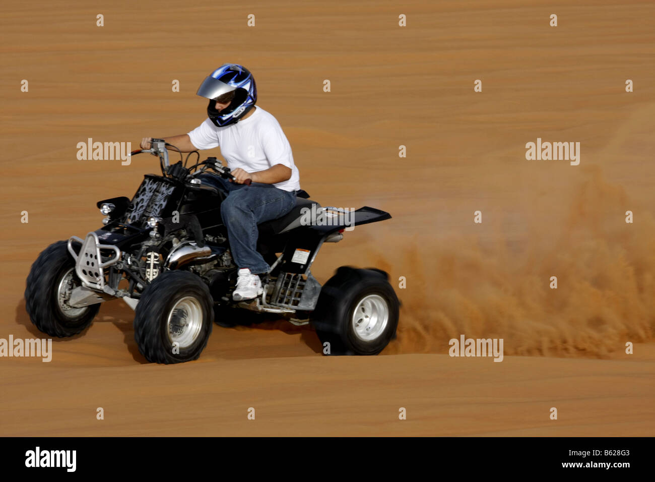 AN ATV AT THE DESERT SAFARI IN DUBAI Stock Photo - Alamy