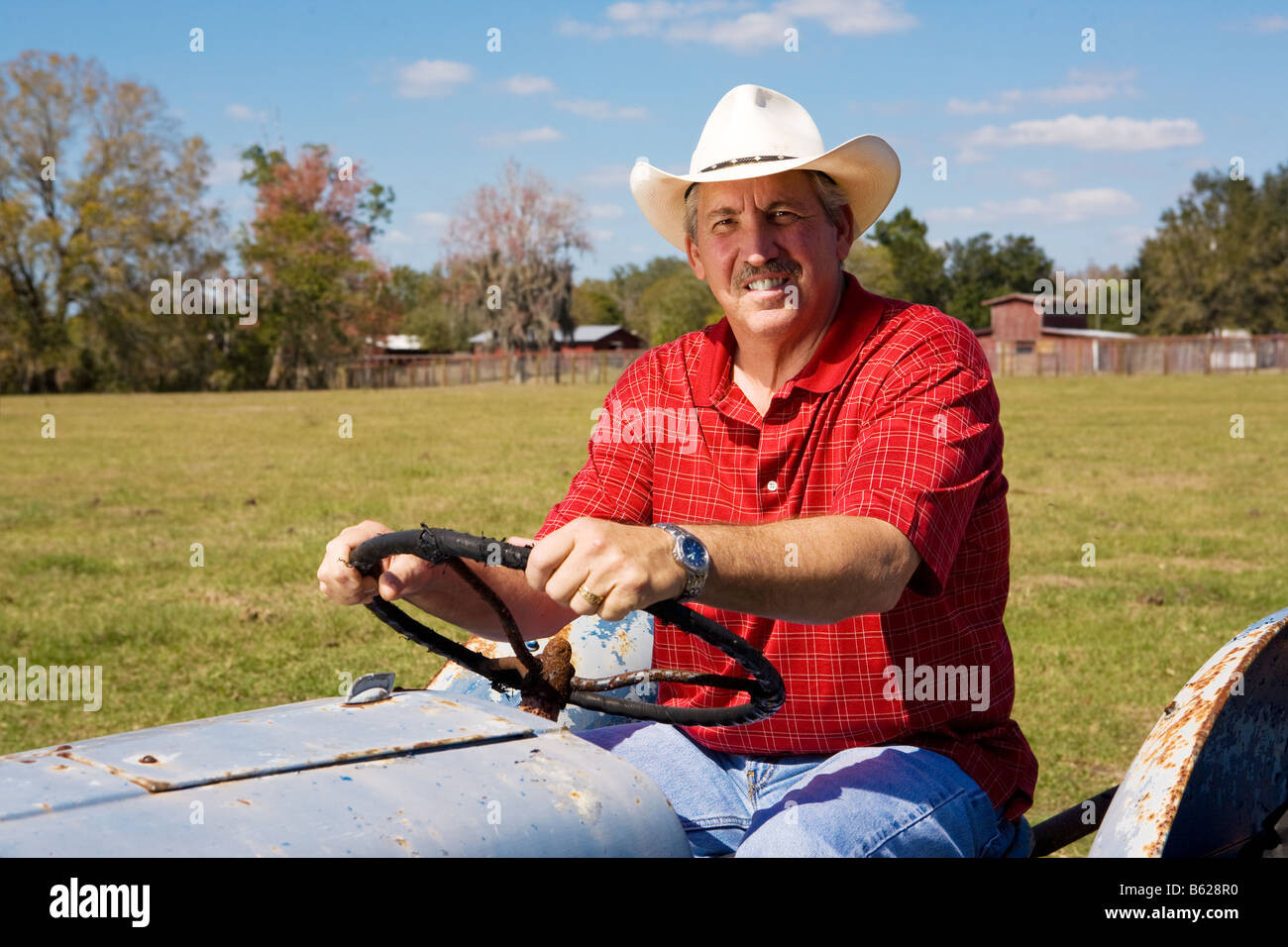 Handsome cowboy riding hi-res stock photography and images - Alamy