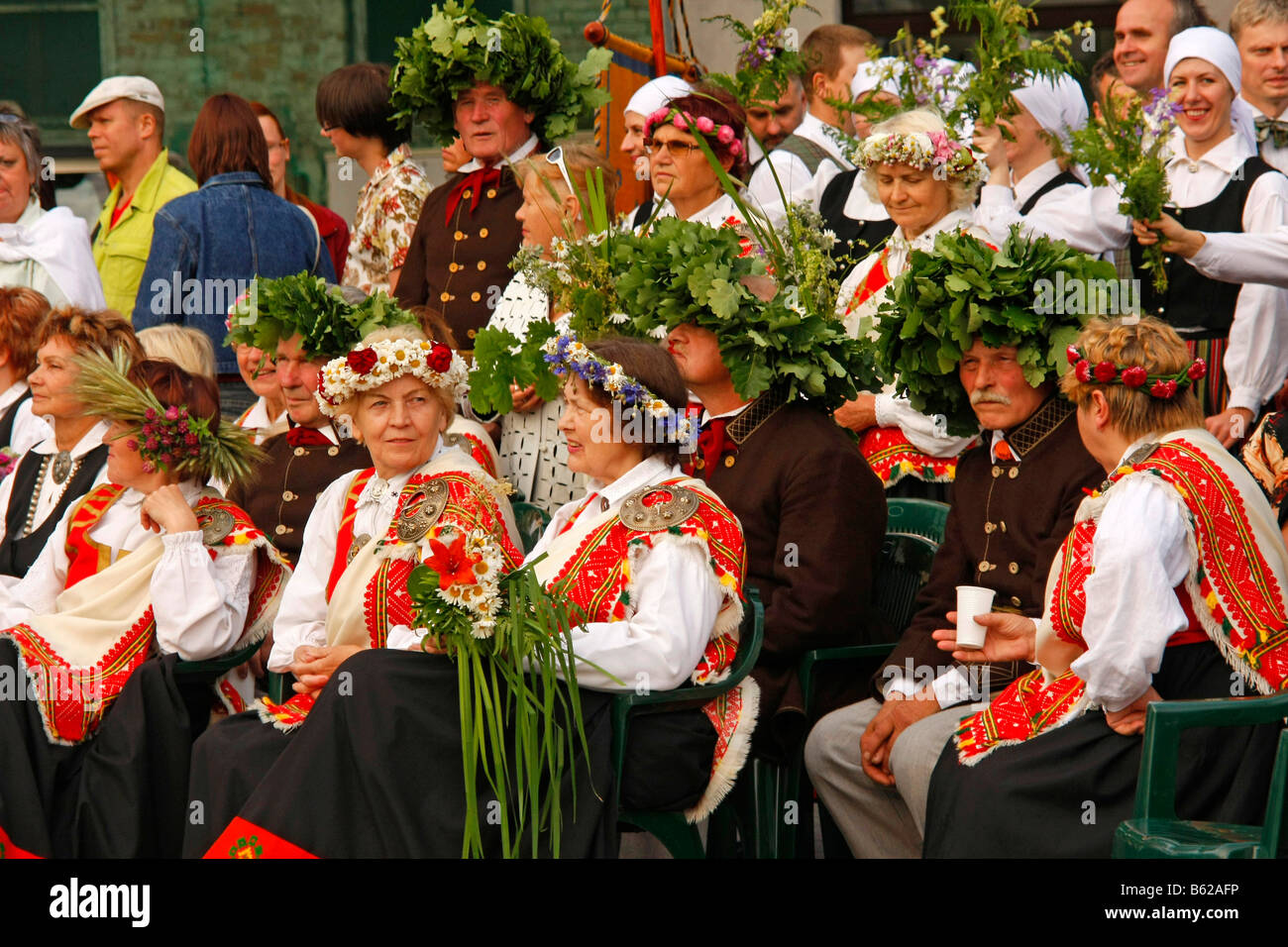 Folk group dressed in traditional costumes at the midsummer festival in ...