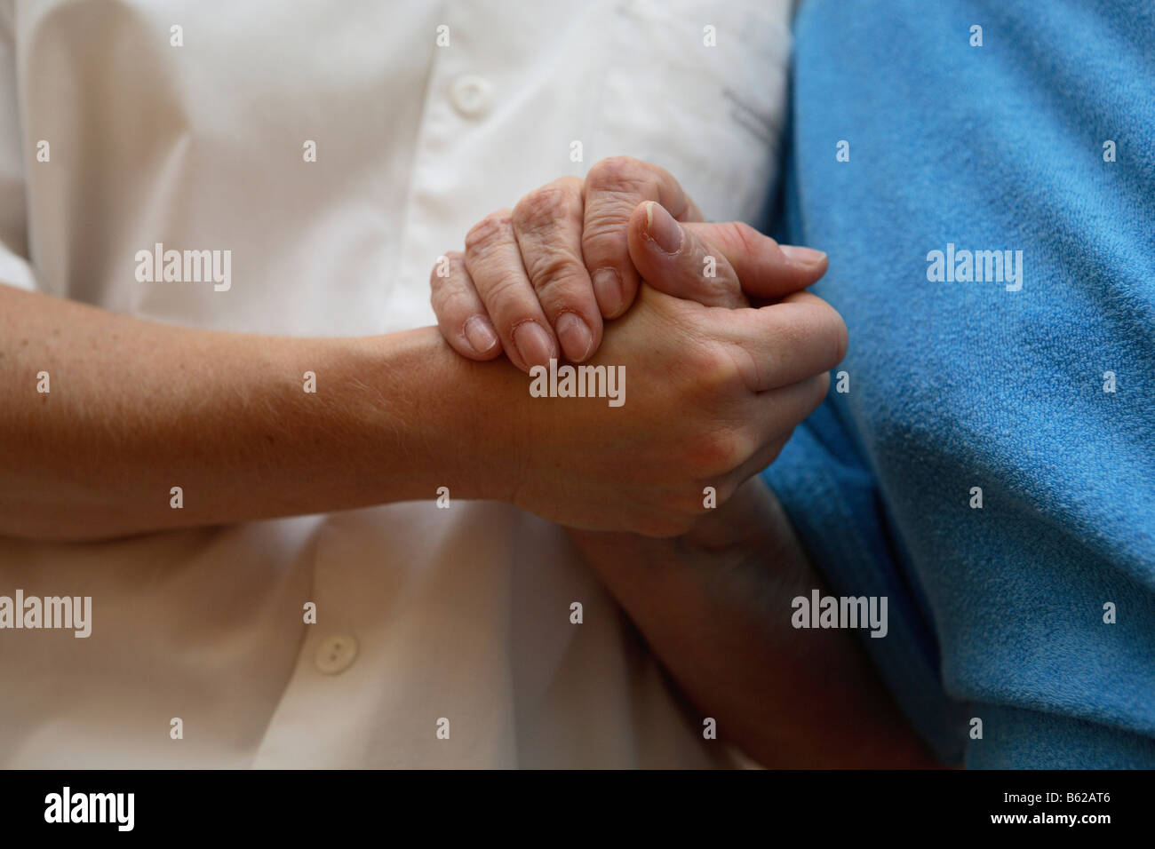 Two hands clasped together Stock Photo - Alamy