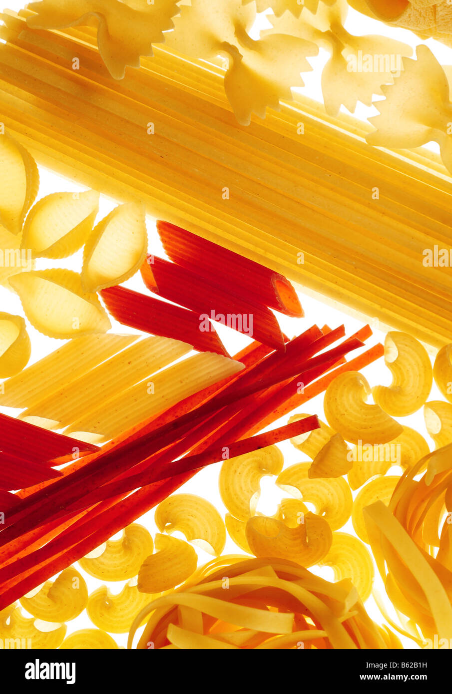 Raw color pasta mix closeup background Stock Photo - Alamy