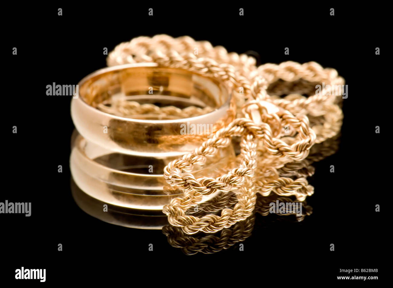 object on black Gold ring on black closeup Stock Photo - Alamy