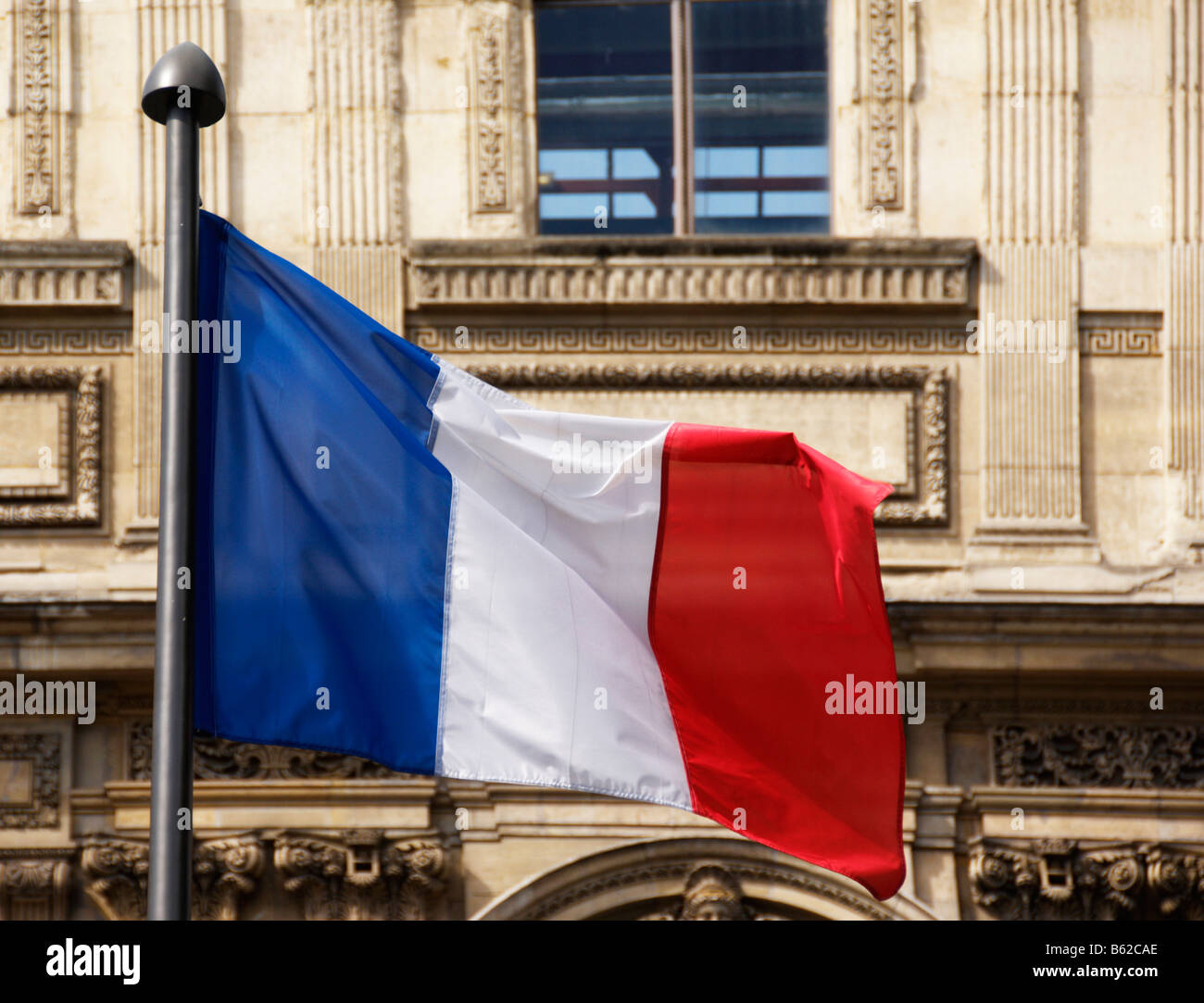 French flag flying in front of the Louvre in Paris, France, Europe ...