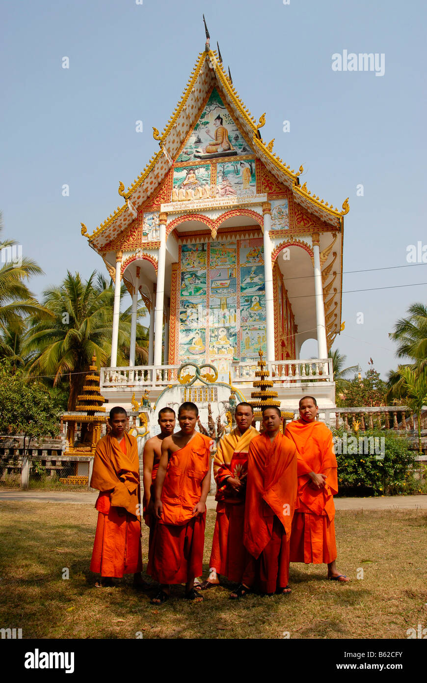 A group of Buddhist monks in front of the tall main hall, Sim, Wat Amon ...