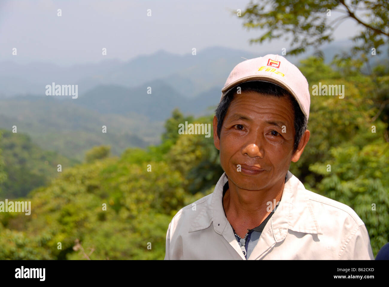 Laotian man, portrait, in natural mountain landscape, Phongsali ...