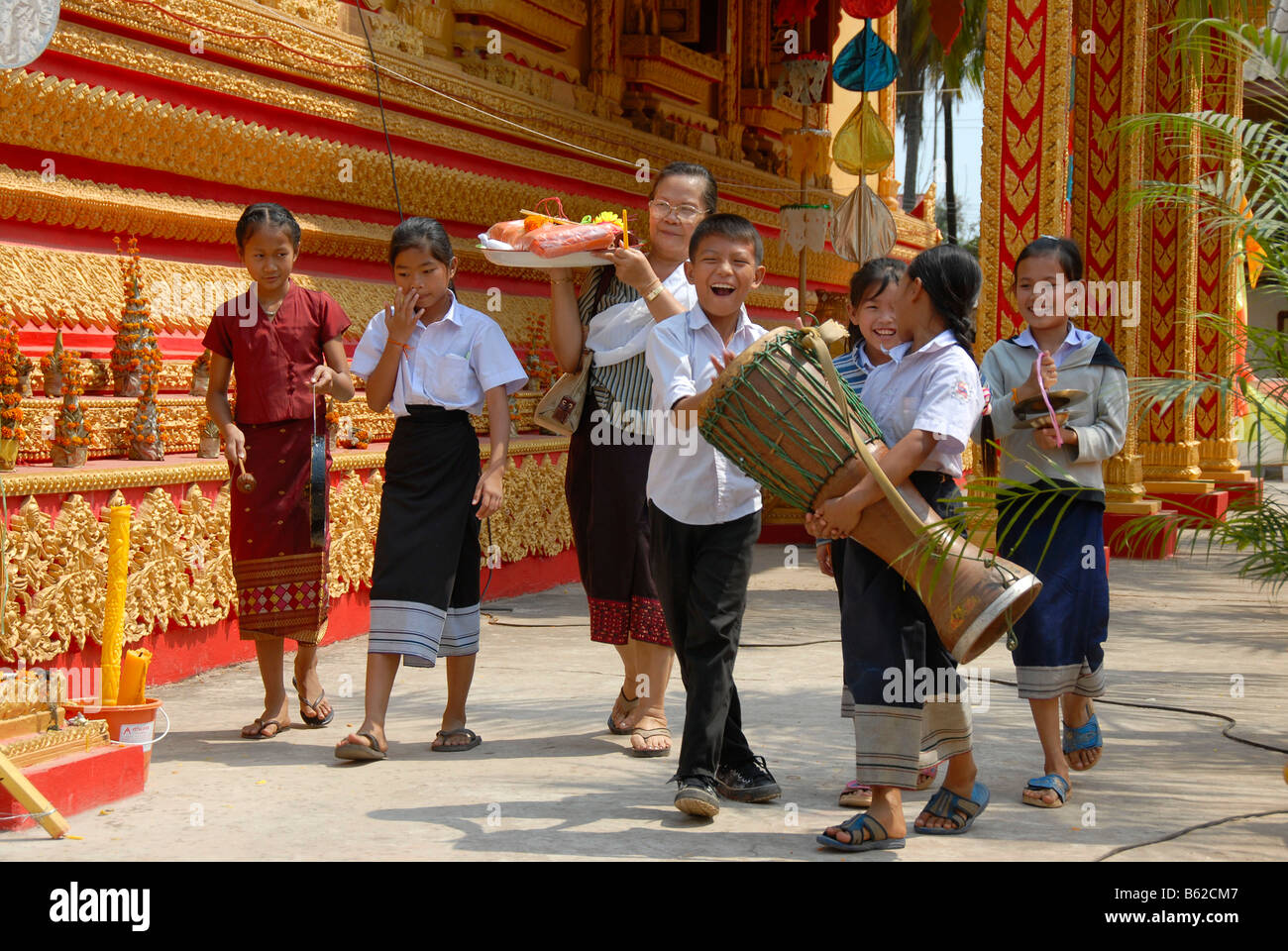 Buddhist family with children during a joyful walk around the temple ...