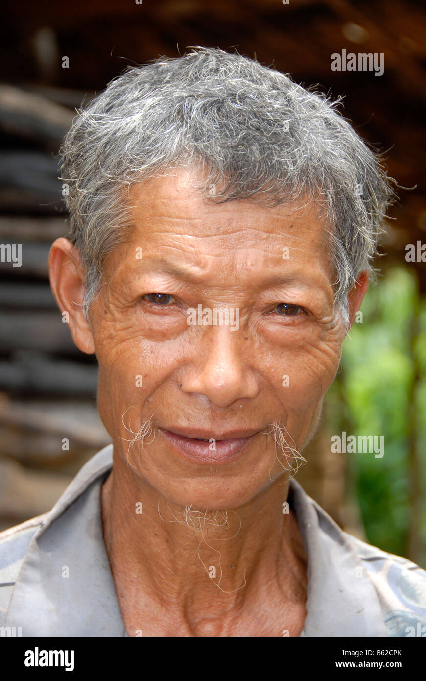 Portrait of an old man of the Akha Djepia tribe in the village of Ban ...