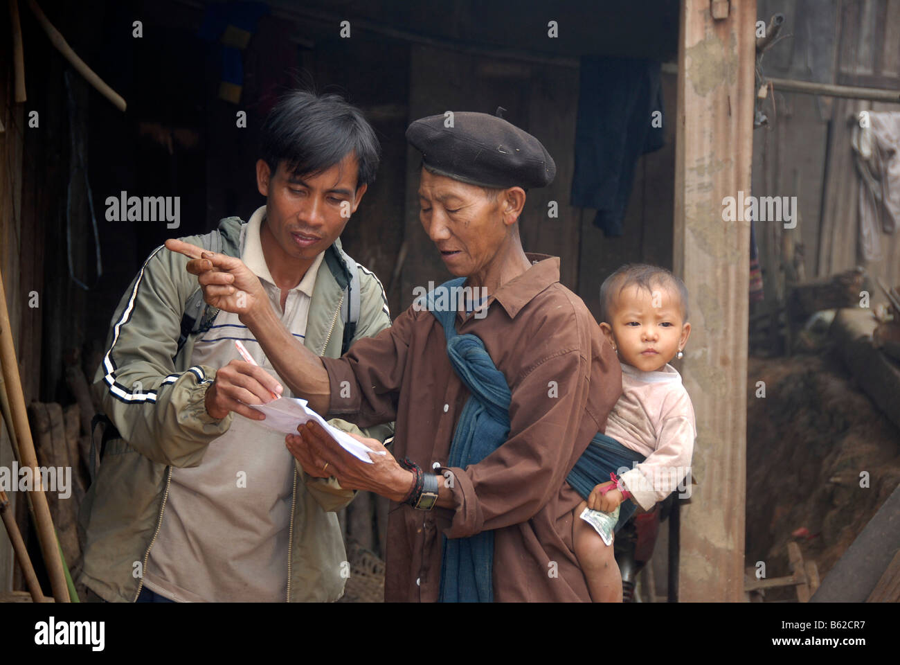 Asking for information, man of the Akha Lom tribe showing the way, Ban ...