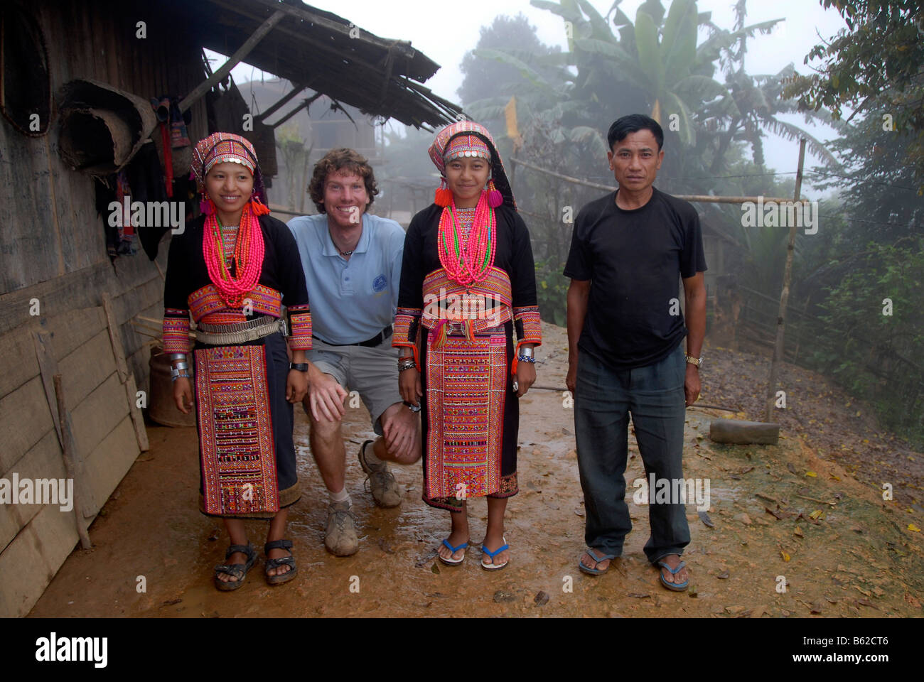 Group picture of a development aid worker with young women of the Akha ...