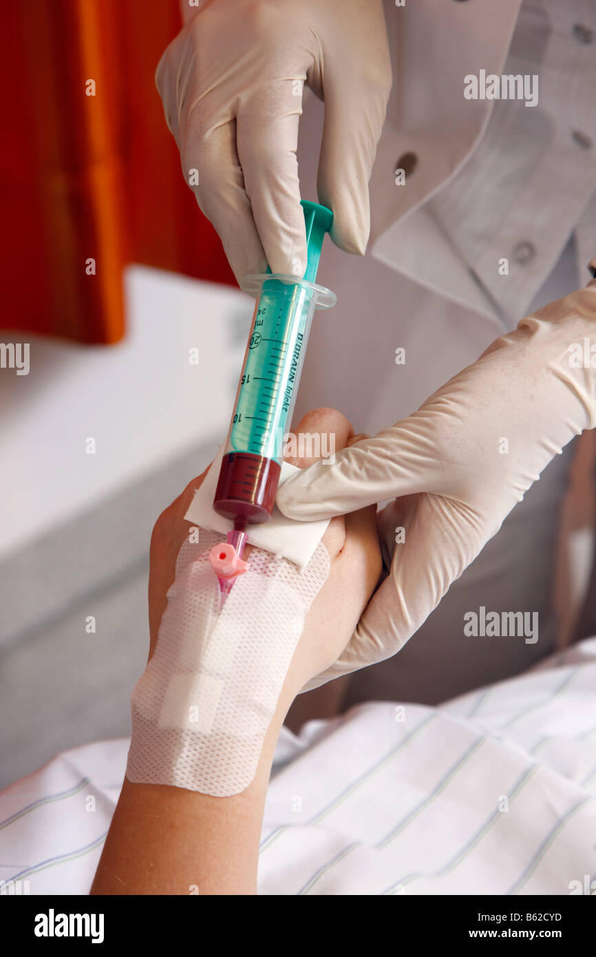 Taking of a blood sample hi-res stock photography and images - Alamy