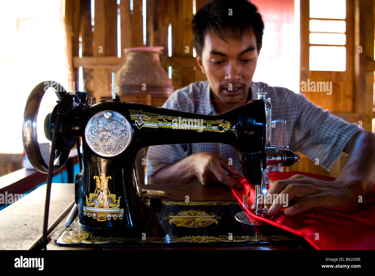 Burmese sewing, Inle Lake, Myanmar, Burma, South East Asia Stock Photo ...