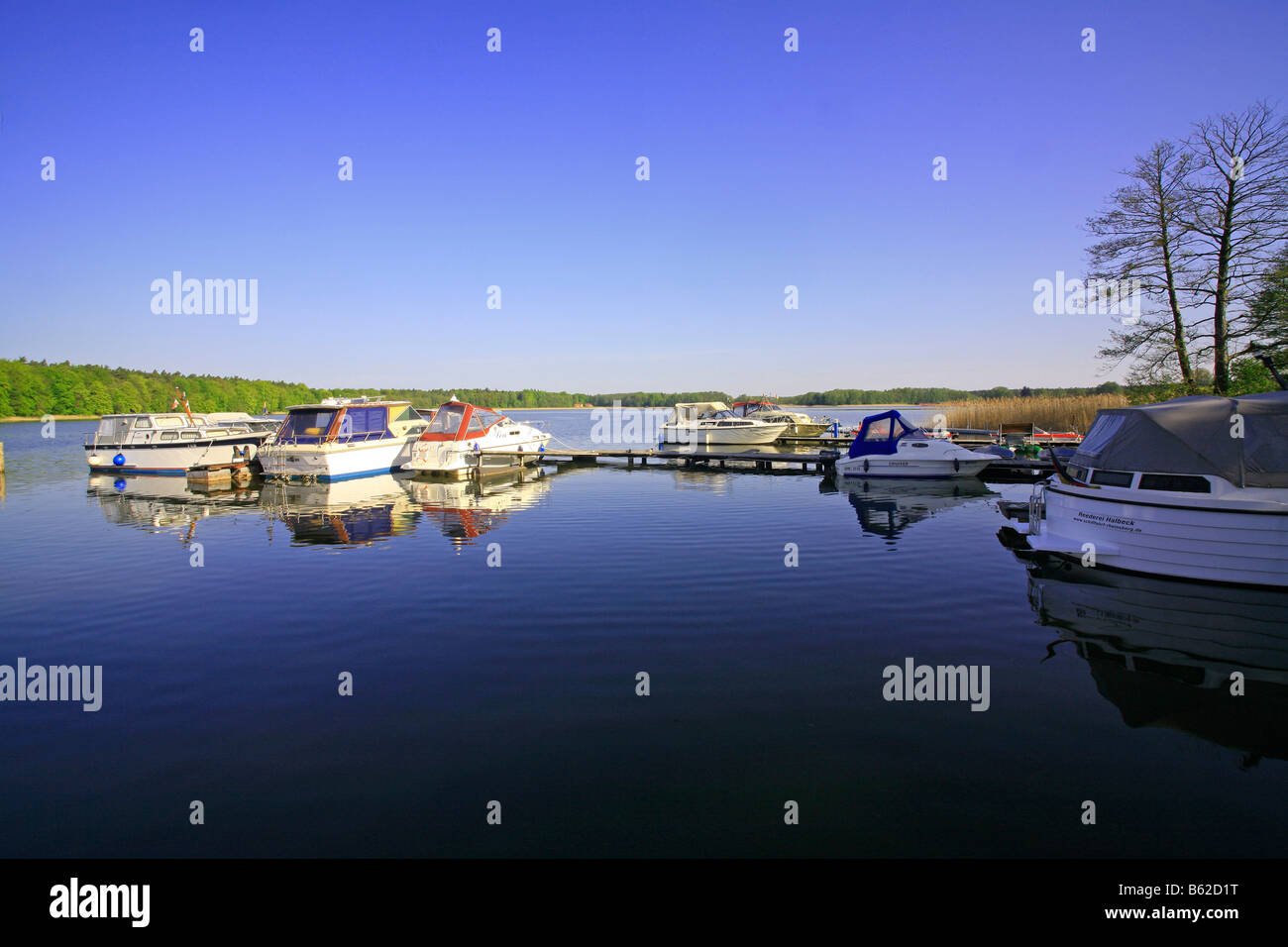 Boats anchored in Rheinsberg Harbour on Lake Grienericksee ...