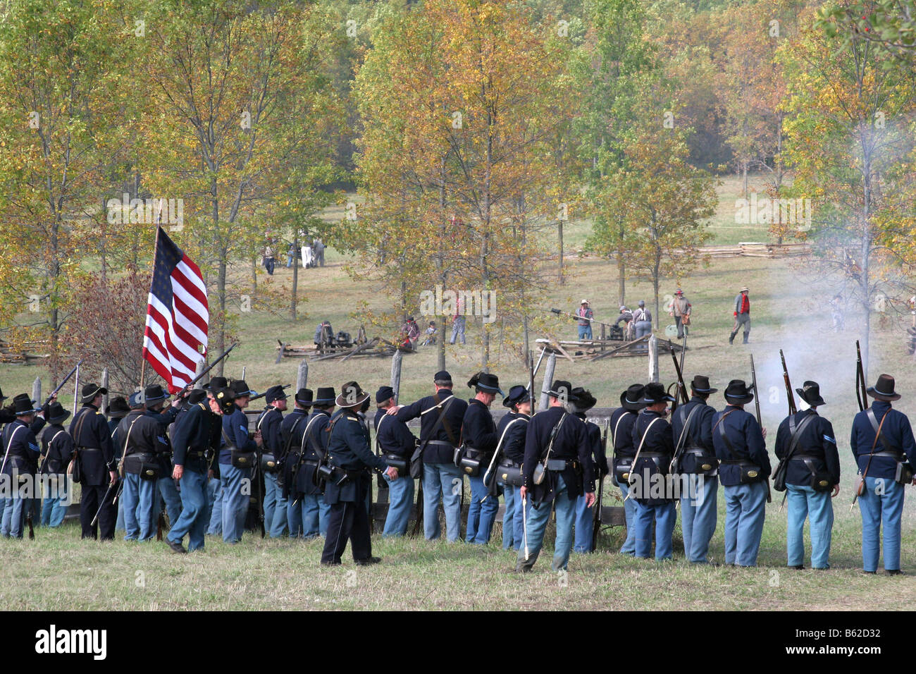 Confederate and Union soldiers stand off fighting a battle during a ...